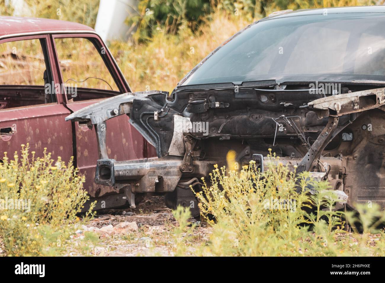 Metal rusty two car body parts abandoned. Car dump, wreck at a junkyard ...