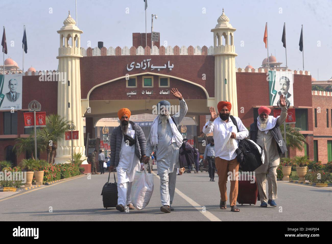 Lahore, Punjab, Pakistan. 17th Nov, 2021. Indian Sikh pilgrims wave to ...