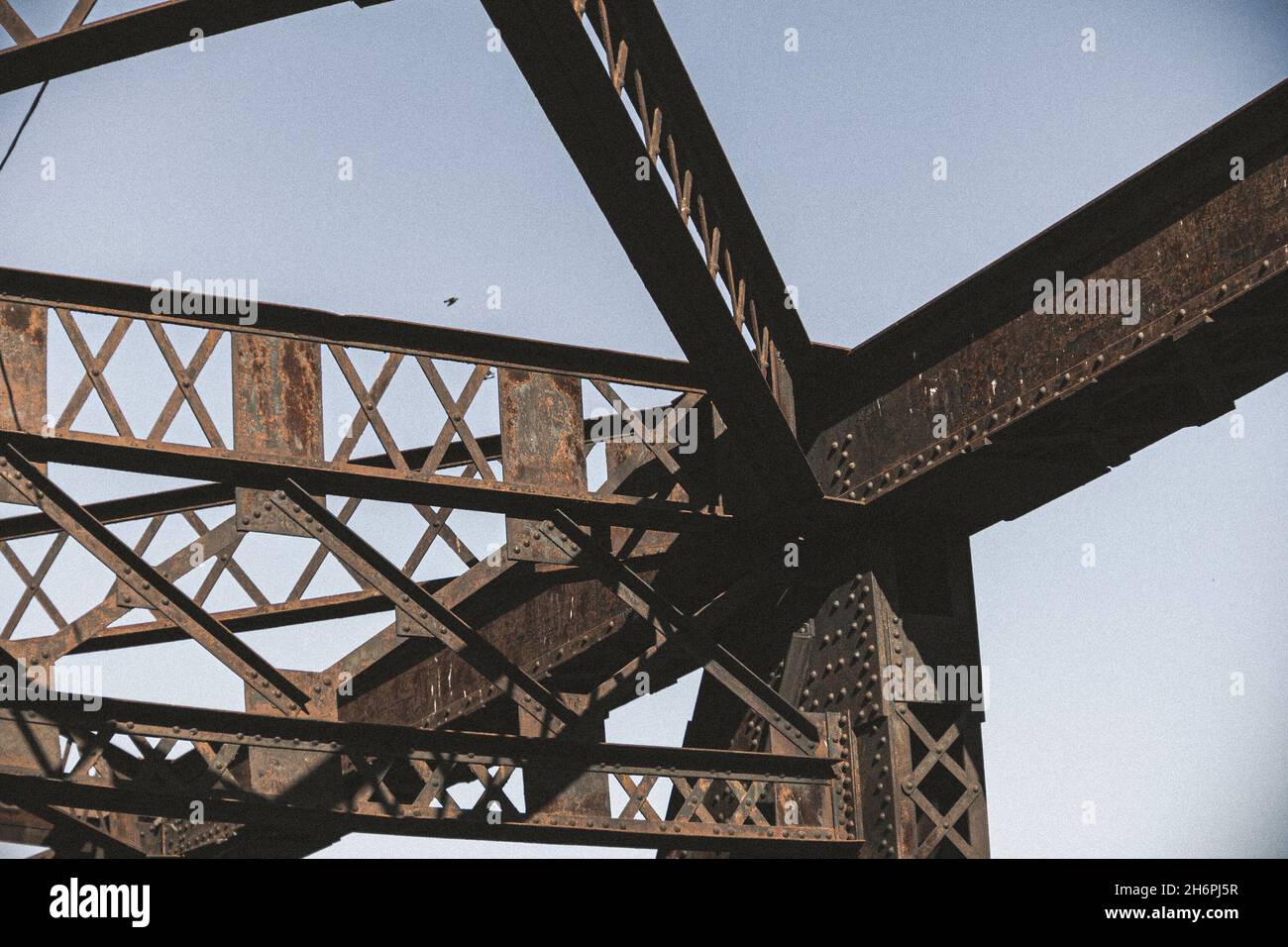 Rusty metal structure of a bridge under a clear sky Stock Photo - Alamy