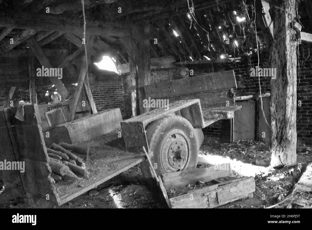 Grayscale shot of an old abandoned factory with broken objects Stock ...