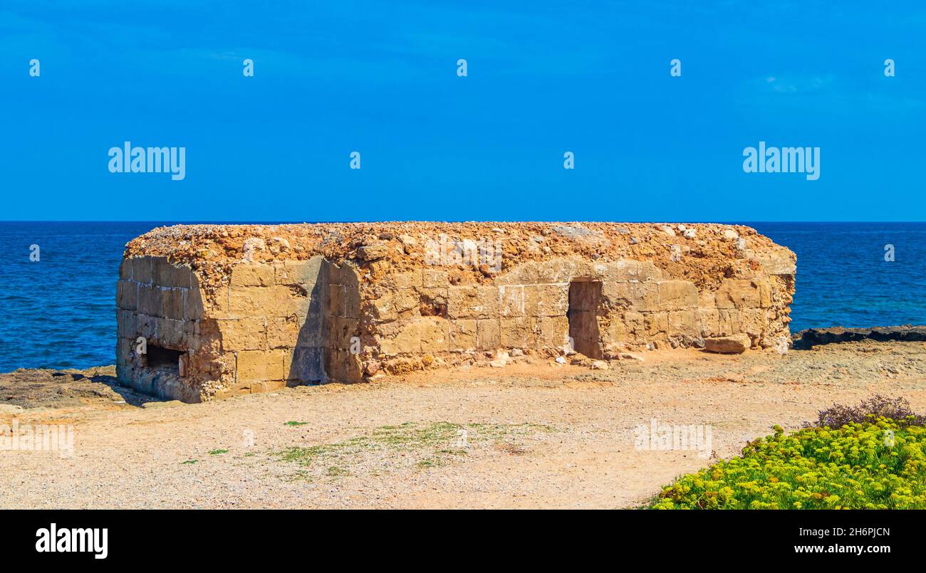 Stone sculptures and ruins in rough natural coastal and beach landscape ...