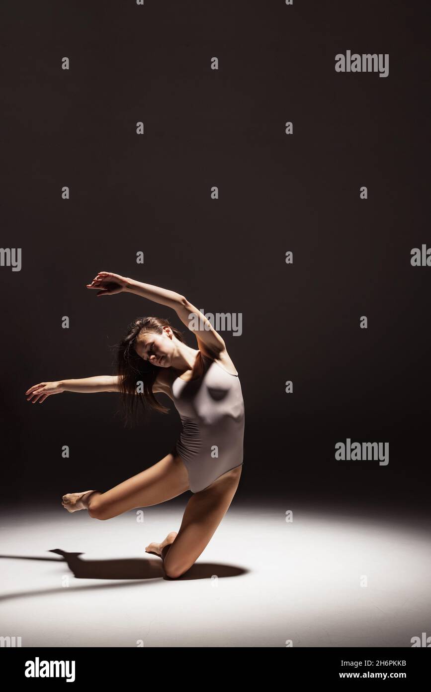 Dynamic portrait of young flexible contemp dancer dancing isolated on ...