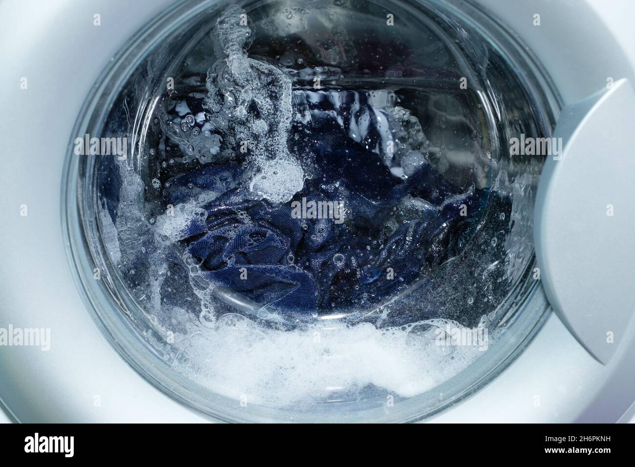 Linen washing in the washing machine Stock Photo - Alamy