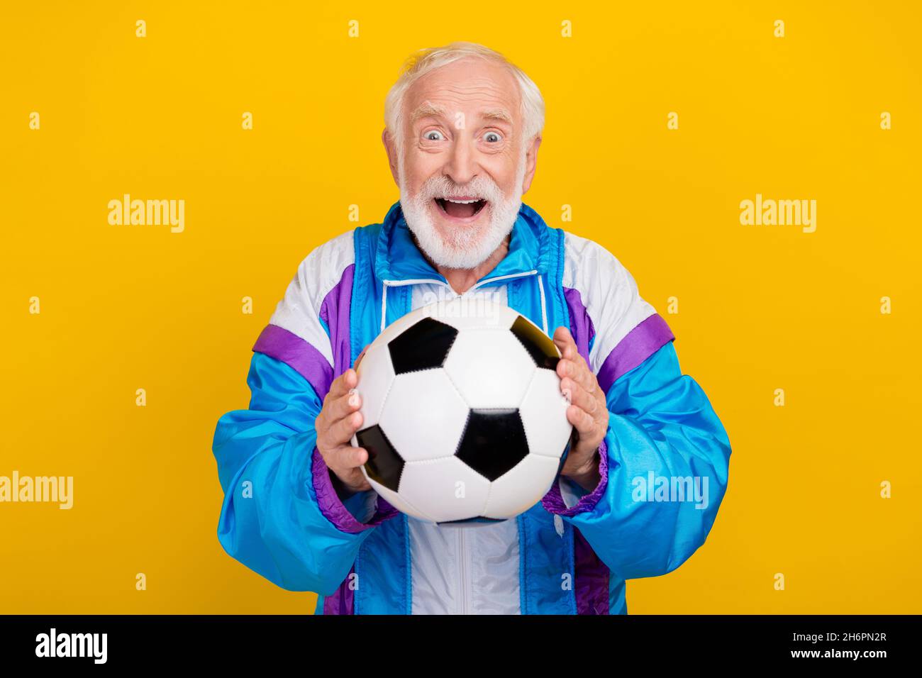 Photo of cheerful retired man competition football player intensive ...