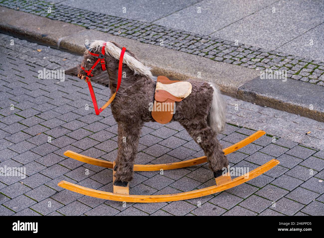 swing toy horse on the road Stock Photo - Alamy