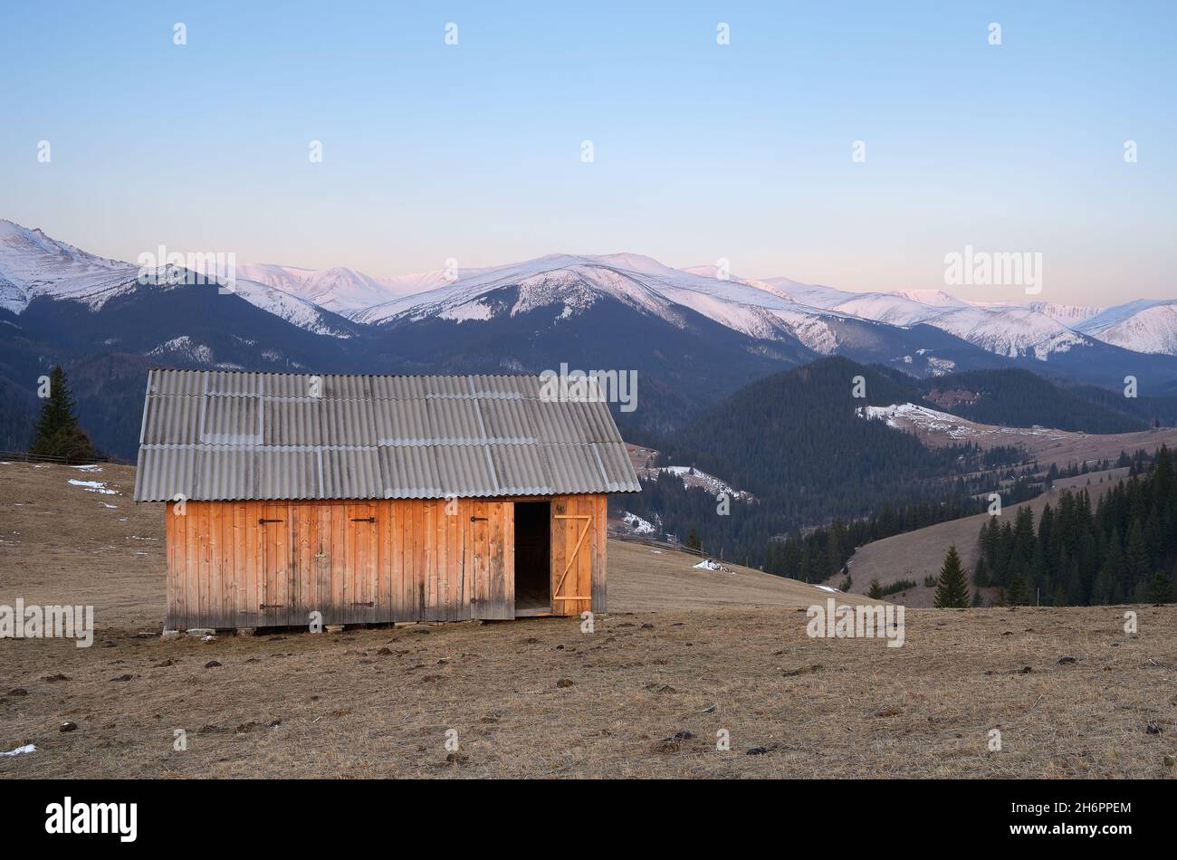 Spring landscape with small wooden house for hay. Carpathian mountains ...