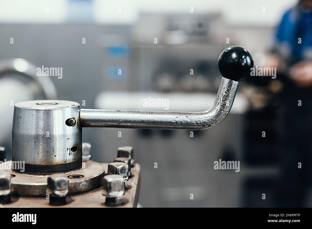 This is metal handle of lathe close-up. Part of industrial equipment ...