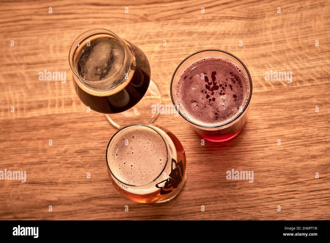 Pouring beer standing at the bar counter. Large craft wise beer in tap ...