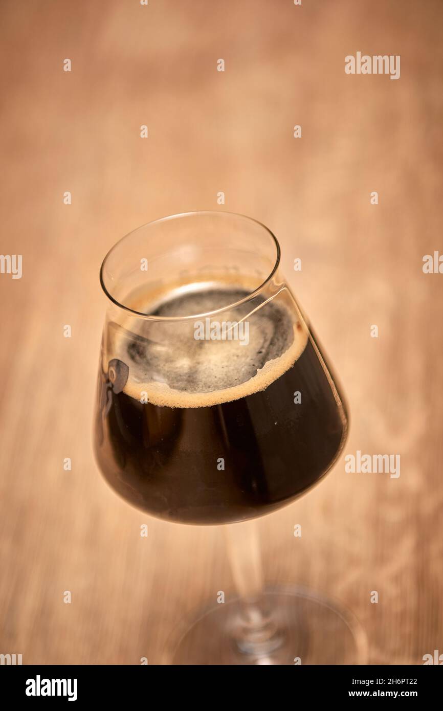 Pouring beer standing at the bar counter. Large craft wise beer in tap ...