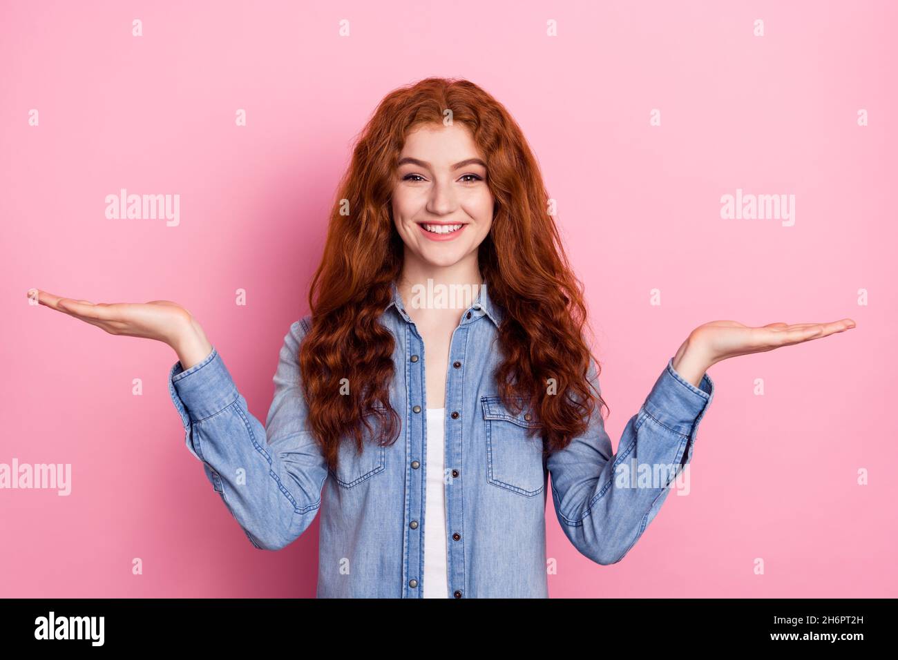 Photo of sweet charming young woman wear denim shirt showing scales ...