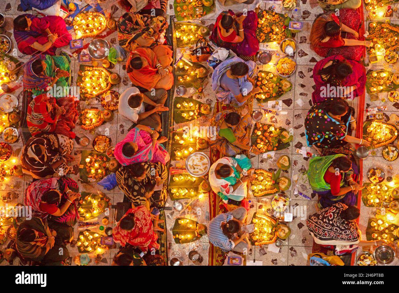 Dhaka, Bangladesh. 09th Nov, 2021. Hindu devotees sit with Prodip ...