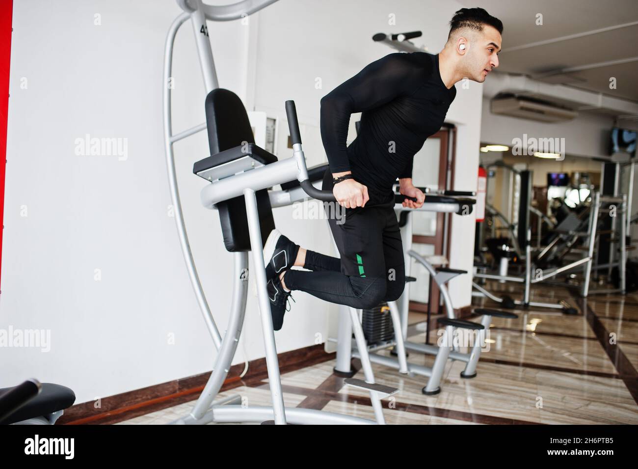 Muscular arab man training in modern gym Stock Photo - Alamy