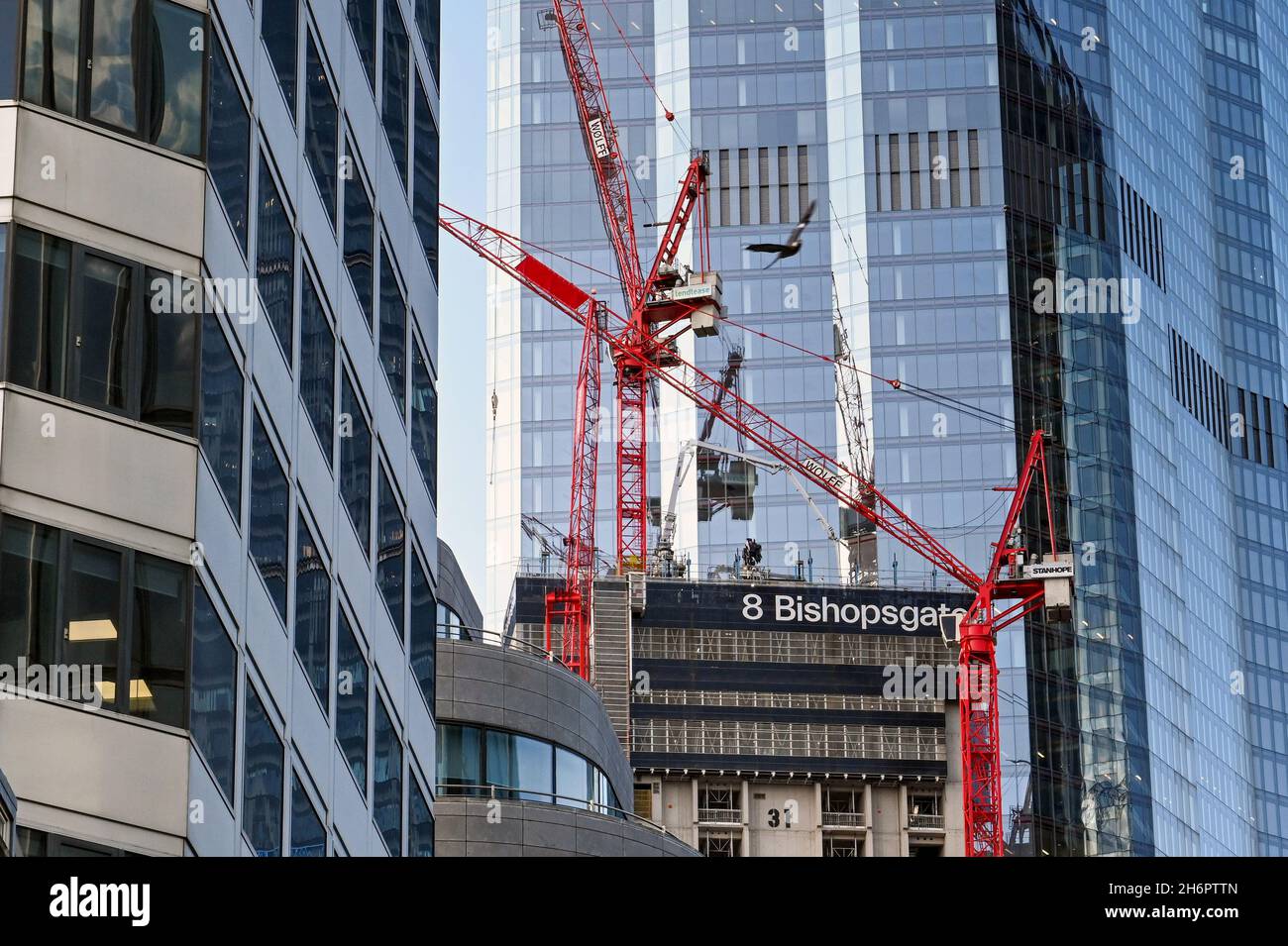 London, England - August 2021: Tower cranes working on a new building ...