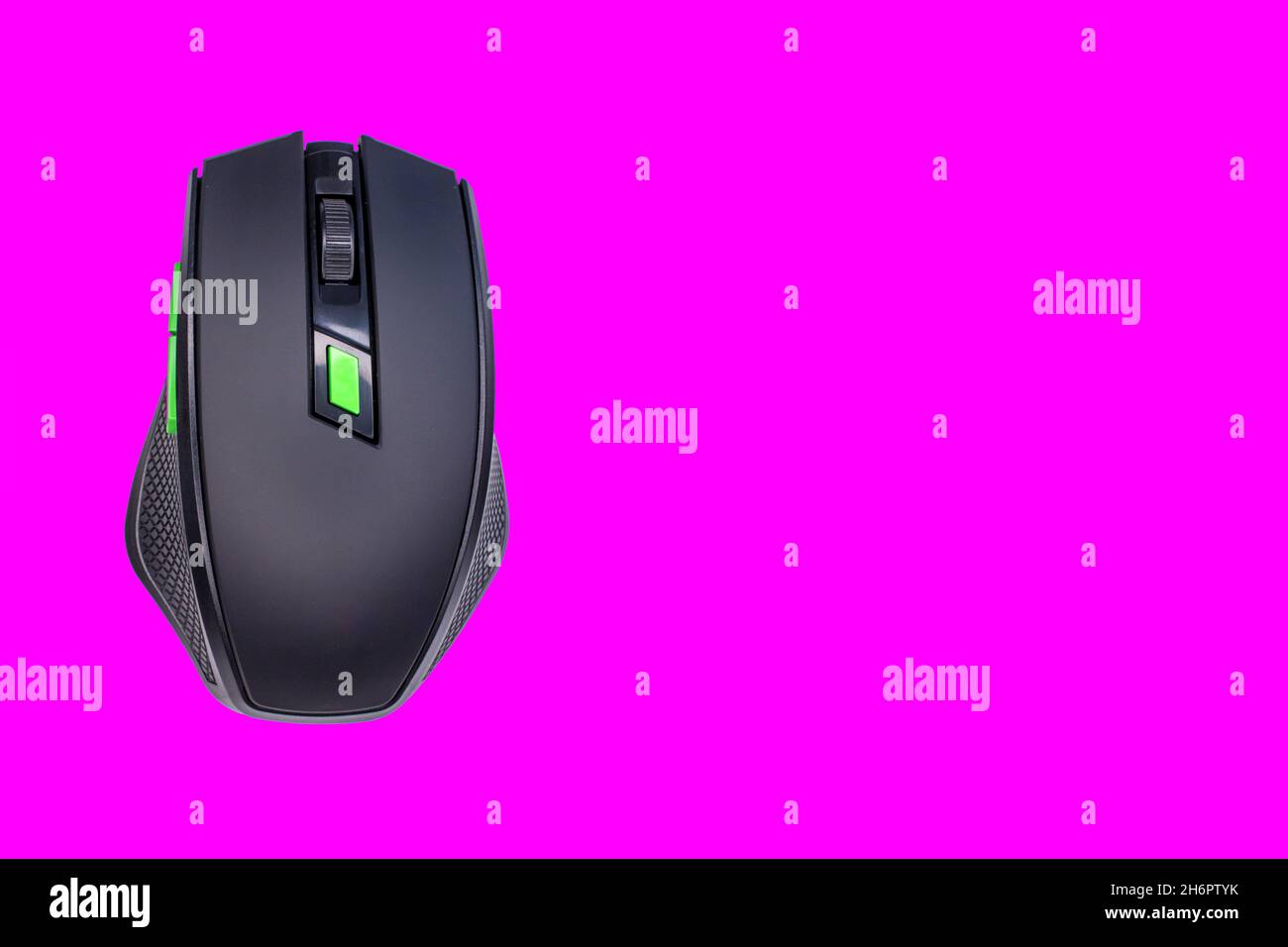 Wireless mouse, top view of black wireless mouse isolated on purple ...