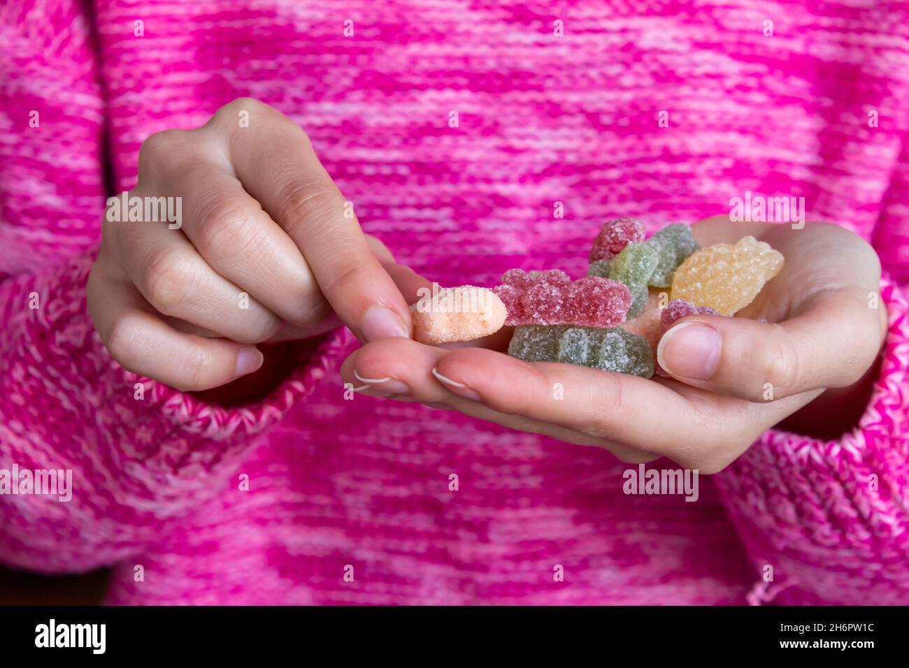 Woman holding candy, close up photo of jelly candy in girl hand Stock ...