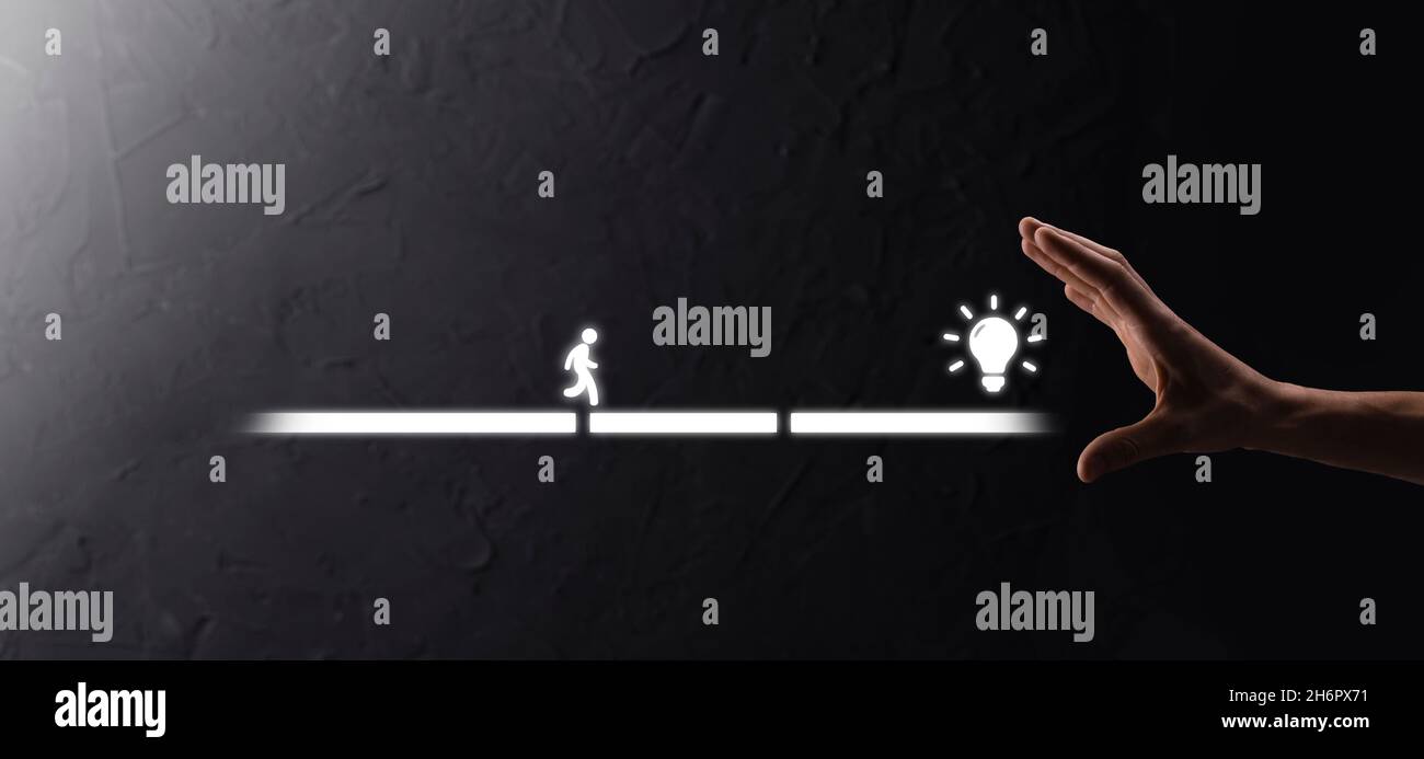 Male business man hand hold a connecting block between two sets of ...