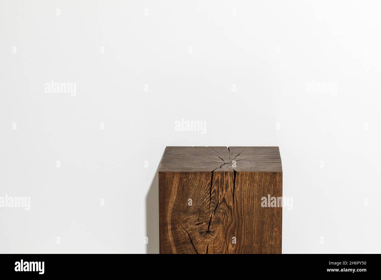 Solid oak wood stump against white wall. Wood coffee table Stock Photo ...