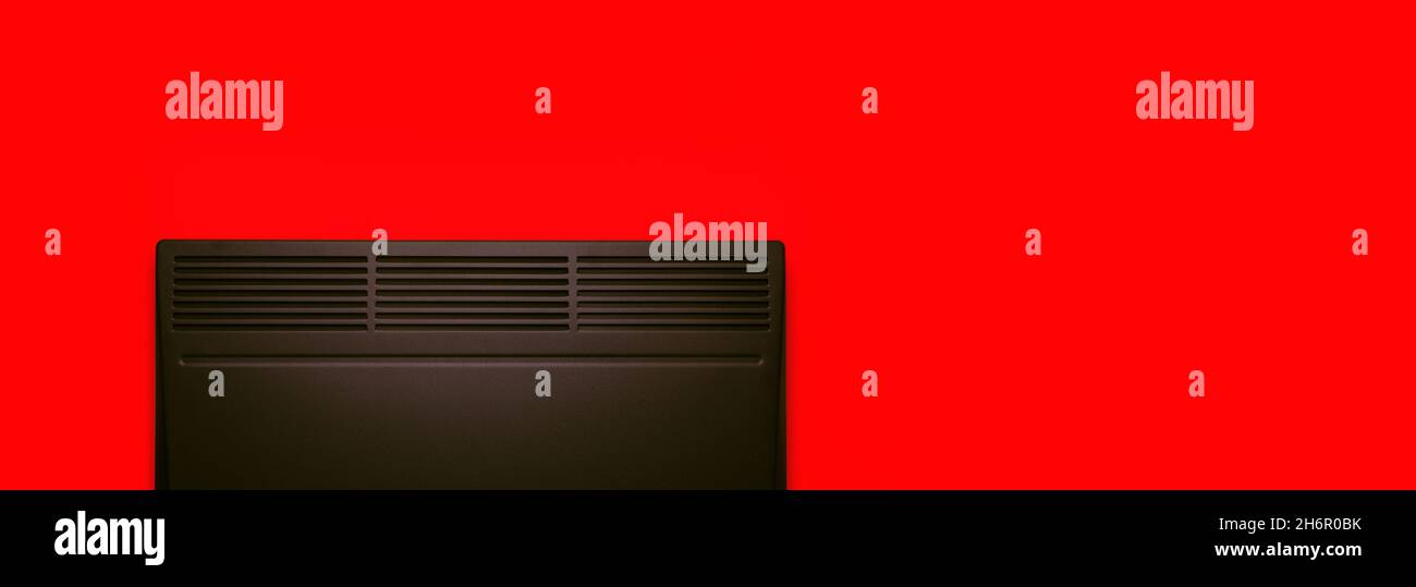 Heating convector over red background, panoramic layout Stock Photo - Alamy