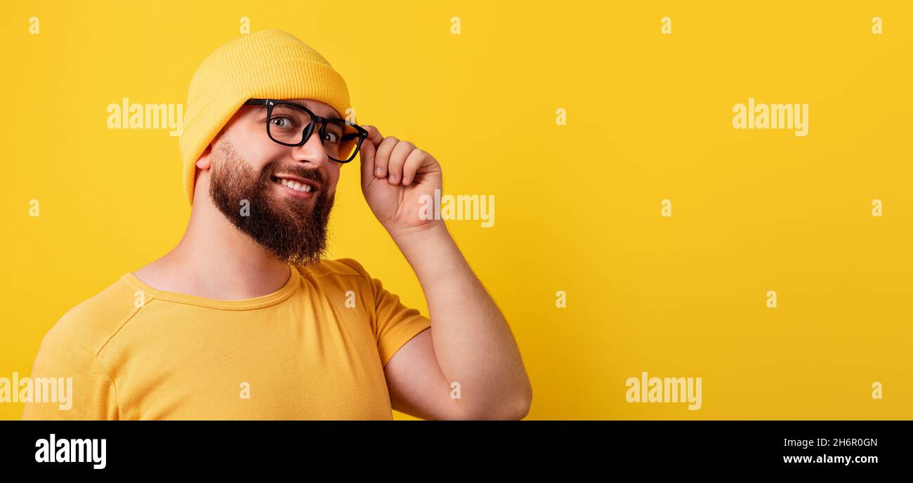 Attractive bearded man in yellow hi-res stock photography and images ...