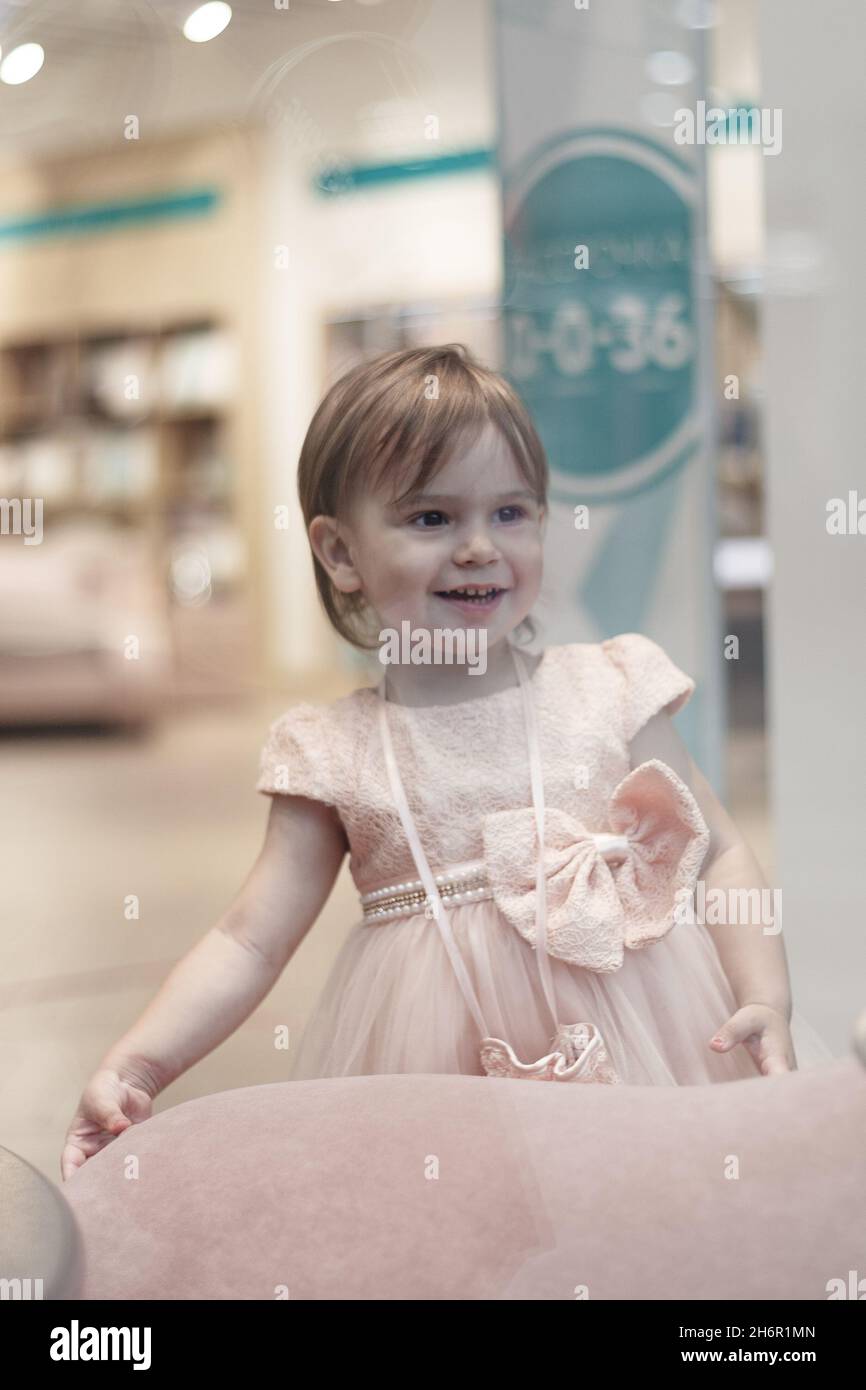 Surprised baby, Wow. in store, baby saw plush toy Stock Photo - Alamy