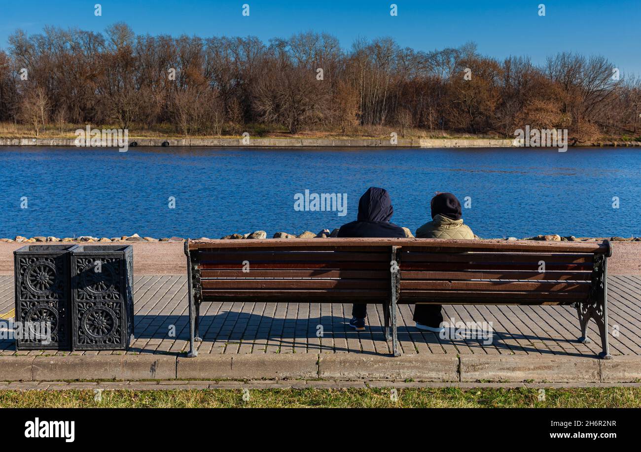 Moscow, Russia - November 06, 2021: people sitting on the bench. High ...