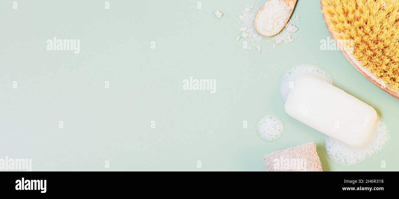 Bathroom and hygiene background with soap bar, sea bath salt, towel and ...