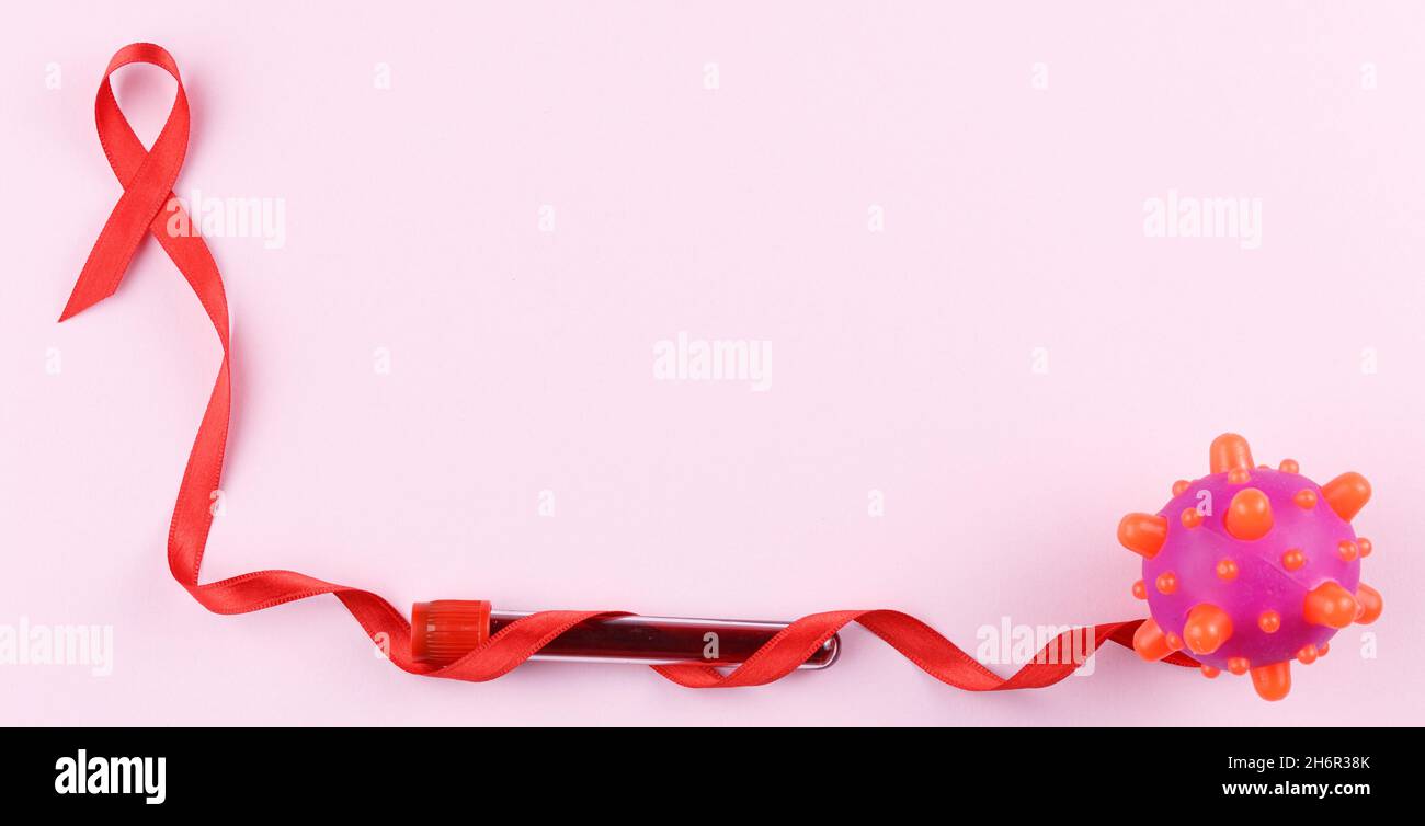 Red ribbon. Cancer control symbol Stock Photo - Alamy
