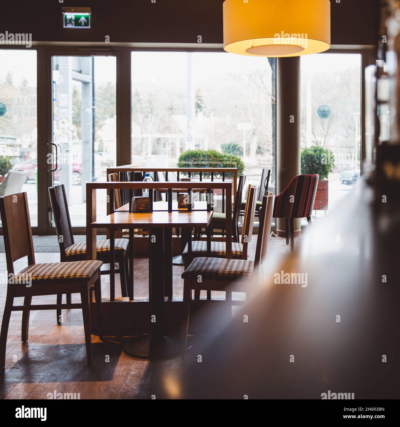 Modern cafe interior in wooden style in sunlight, nobody Stock Photo ...