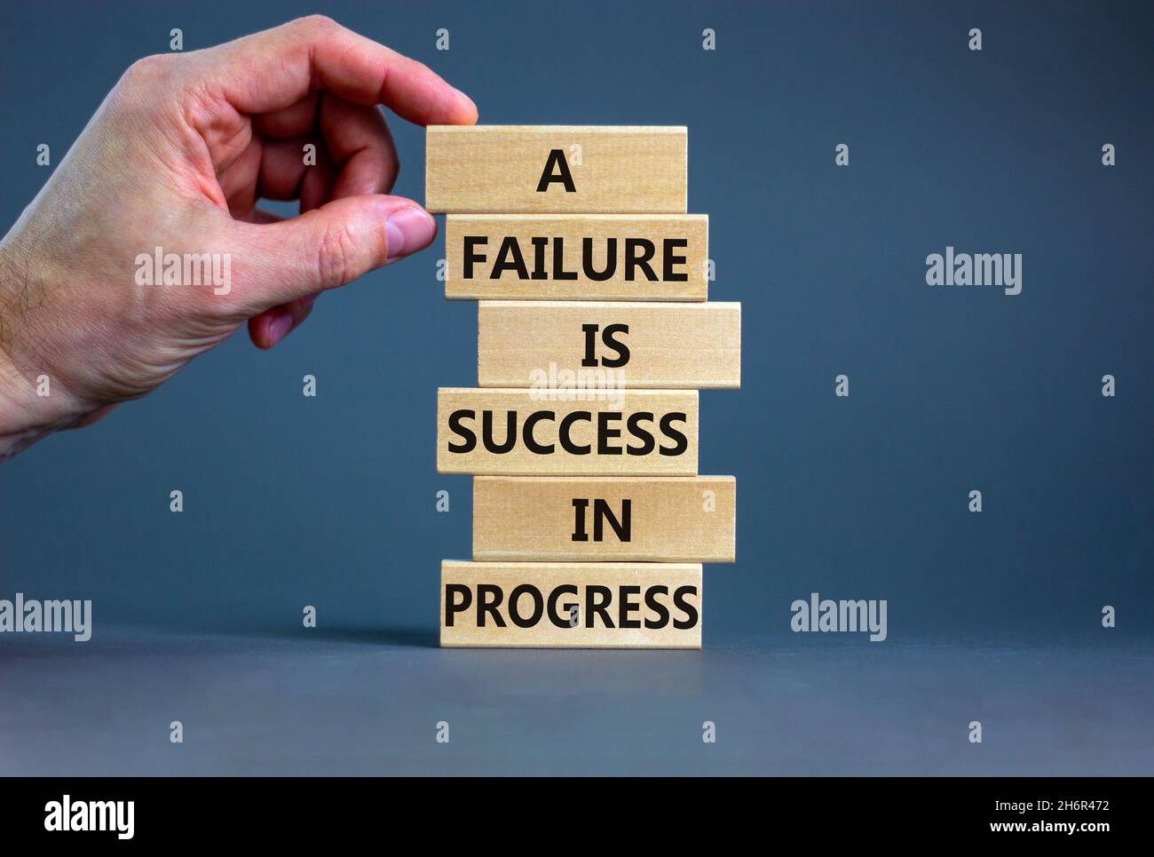Failure or success symbol. Wooden blocks with words A failure is ...
