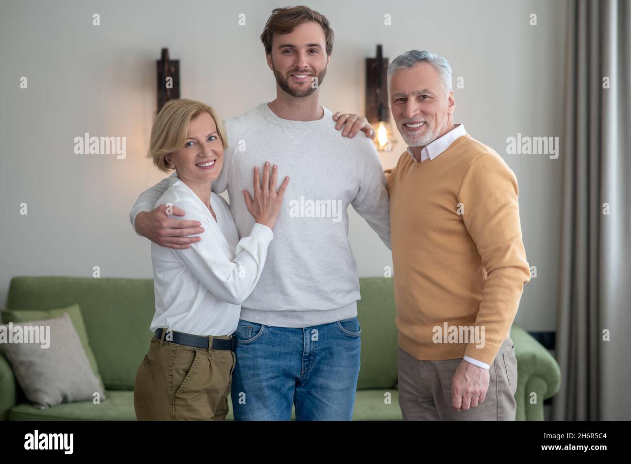 Family togather feeling happy and contented Stock Photo - Alamy