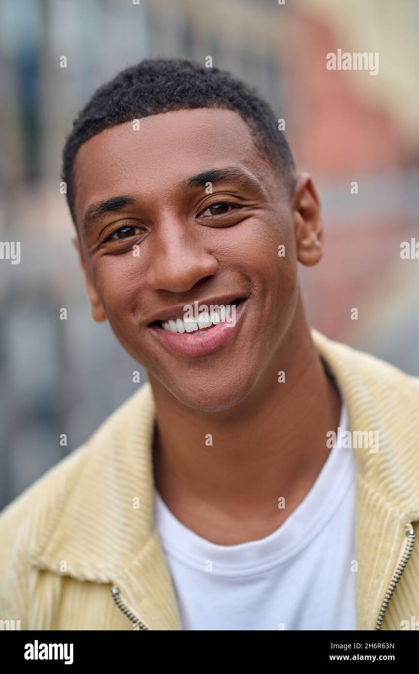 Headshot of a smiling handsome young man Stock Photo - Alamy