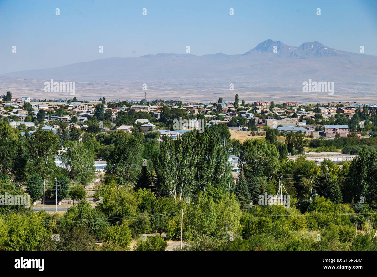 Aerial view of an old town and mountains in the distance Stock Photo ...