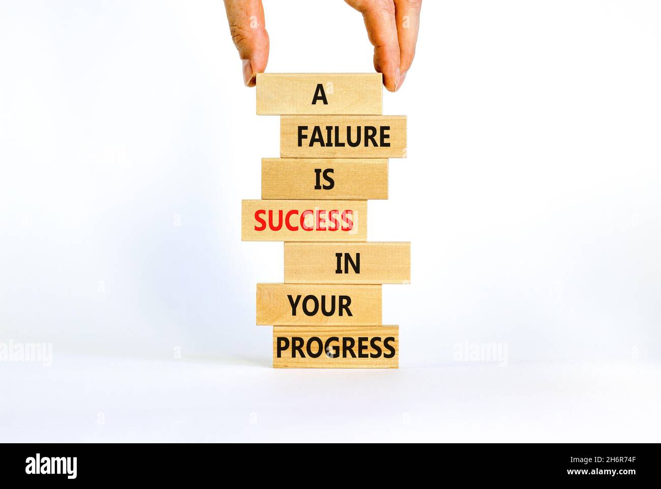 Failure or success symbol. Wooden blocks with words A failure is ...