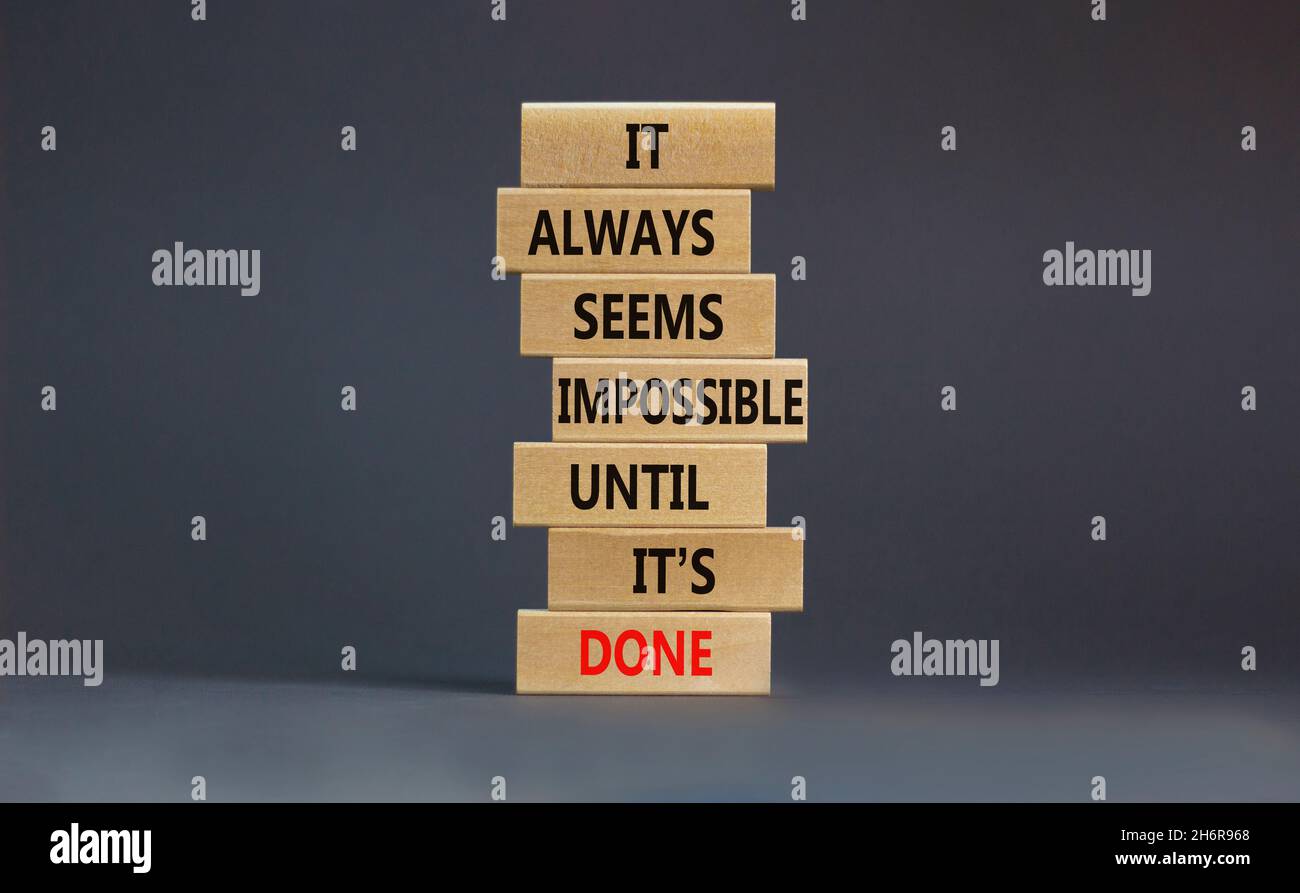 Possible or impossible symbol. Wooden blocks with words It always seems ...