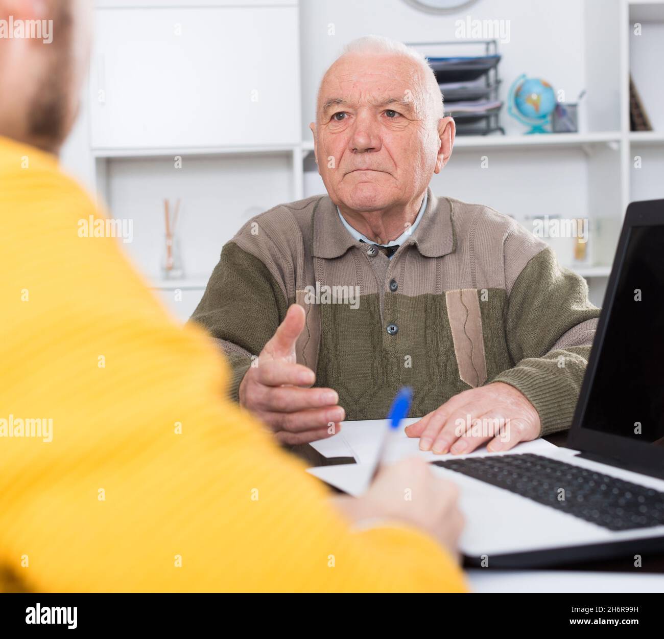 Bank man signing hi-res stock photography and images - Alamy