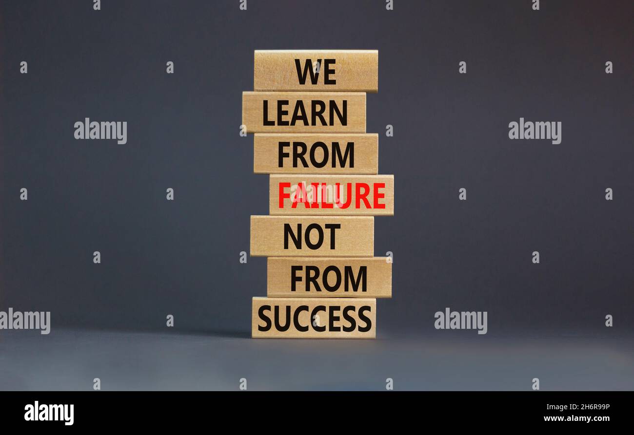Failure or success symbol. Wooden blocks with words We learn from failure not from success ...