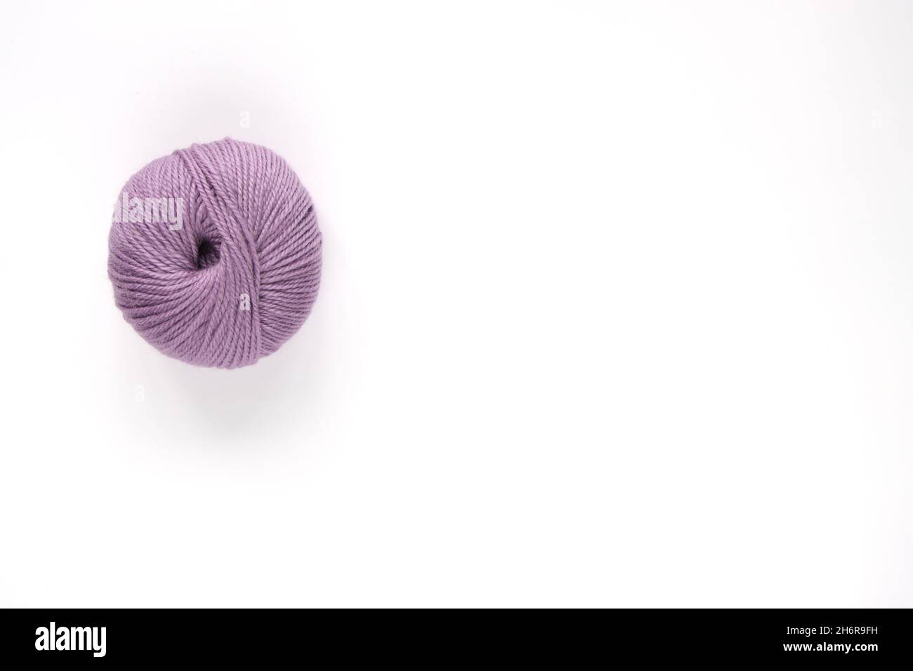 Ball of purple yarn. Isolated on white background Stock Photo - Alamy