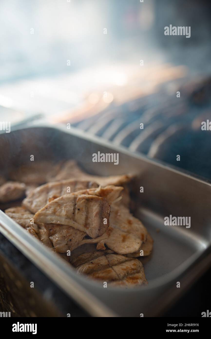 grilled chicken fillet in a metal dish Stock Photo - Alamy