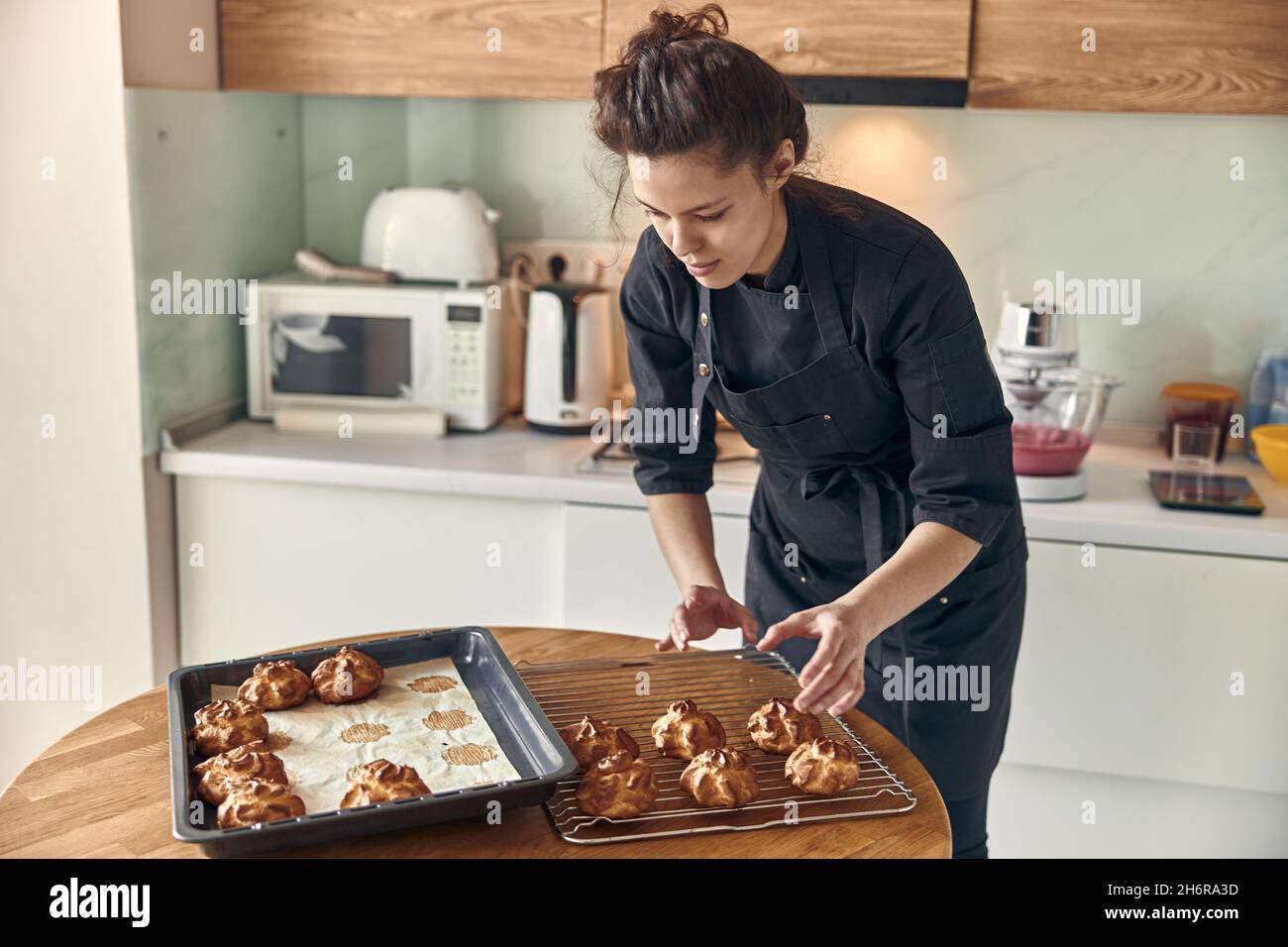 Woman preparing cakes hi-res stock photography and images - Alamy