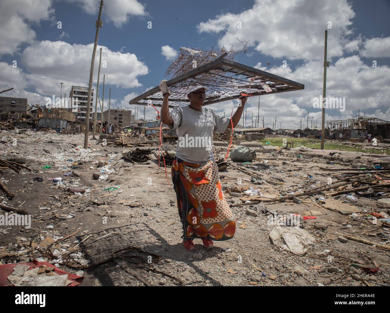 Nairobi, Kenya. 17th Nov, 2021. A woman relocates with carrying her bed ...
