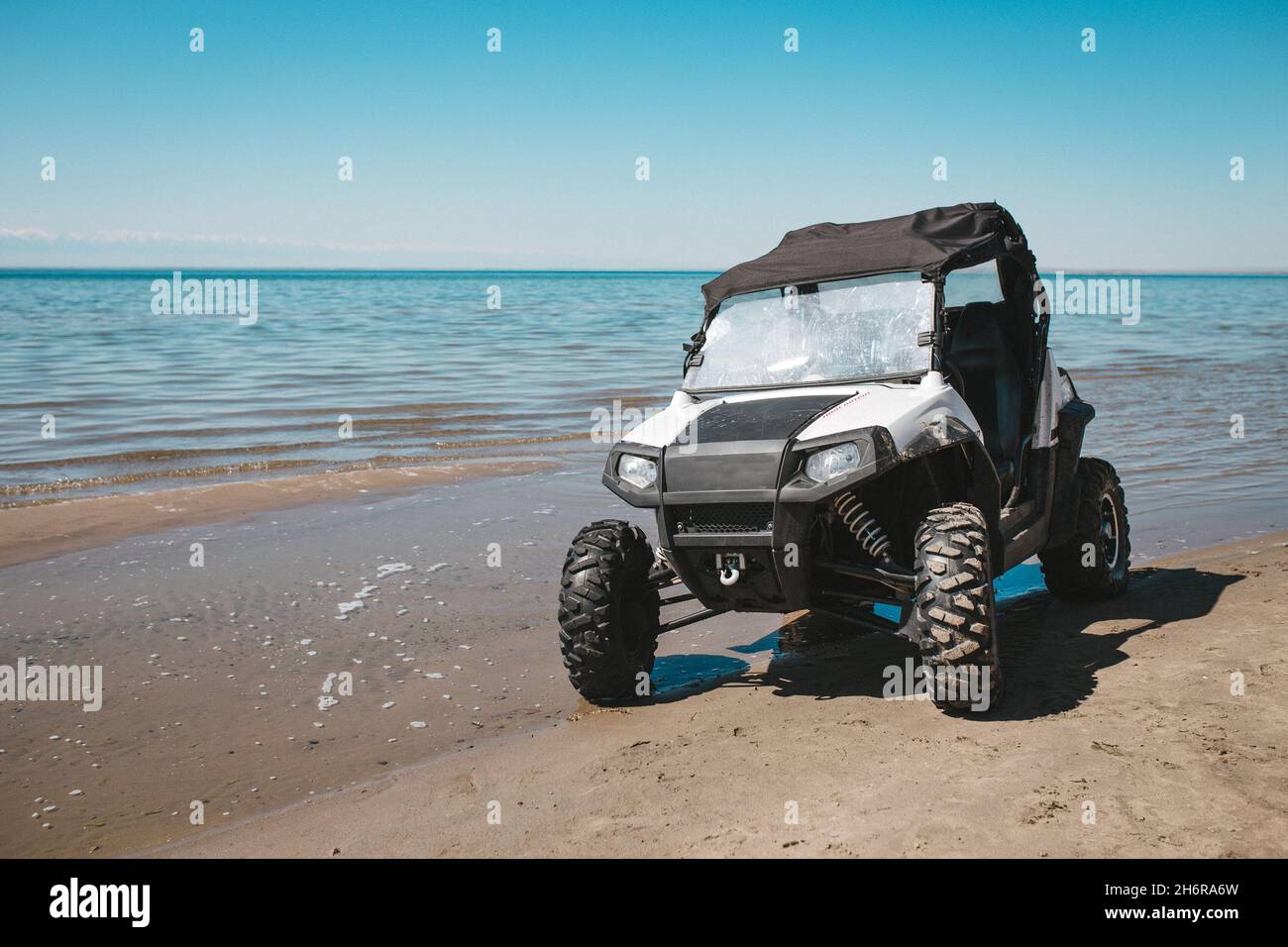 ATV near the seashore. technique against the backdrop of a beautiful ...