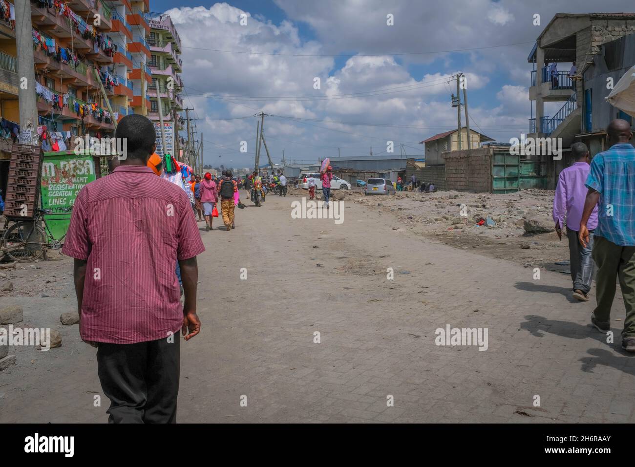 Nairobi, Kenya. 17th Nov, 2021. Homeless residents walk past the ...