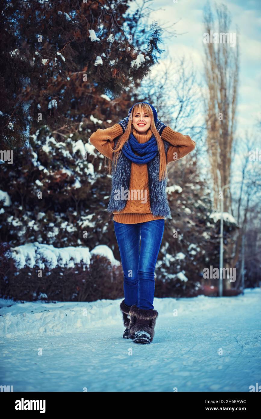 Spectacular Caucasian blond woman laughing while posing on snow ...