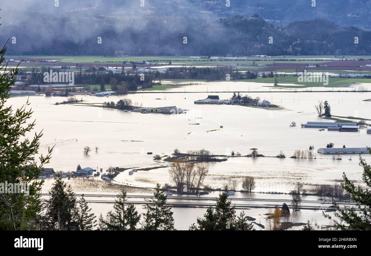 Devestating Flood and black smoke from fire in the city and farmland ...