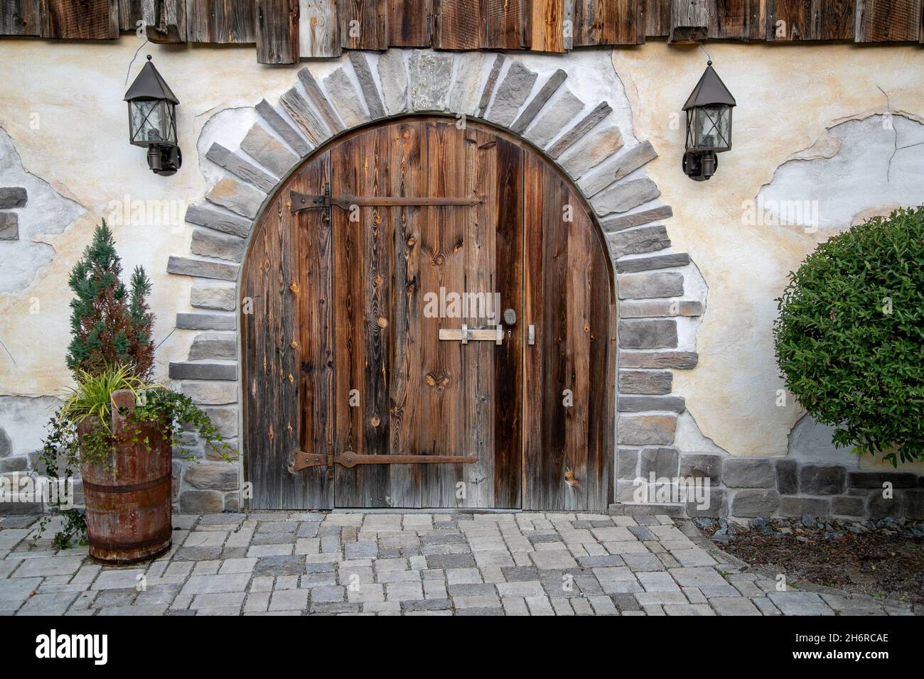 Old wooden arched doorway in medieval style Stock Photo - Alamy