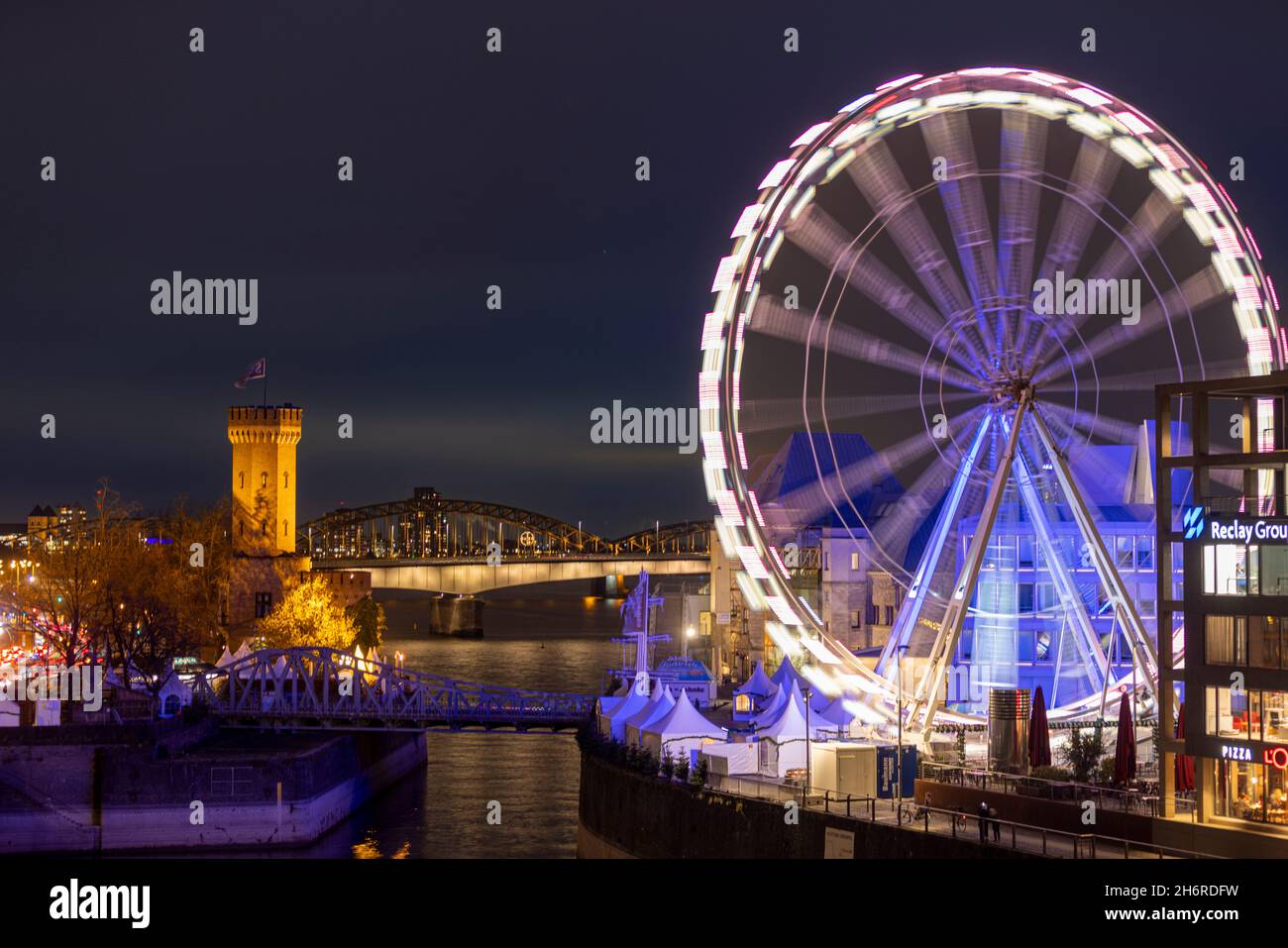 Cologne urban skyline above Rhine river with illuminated buildings ...