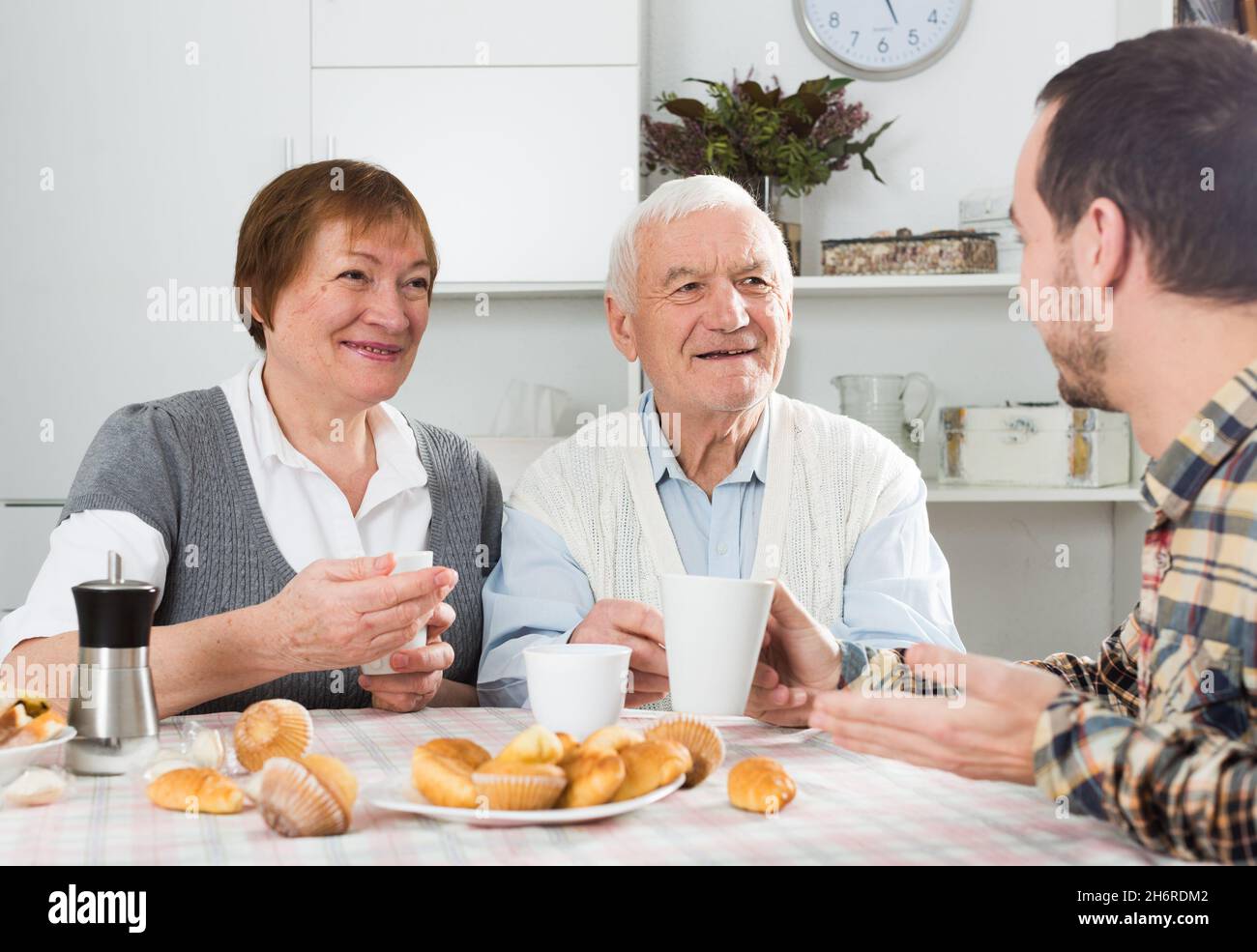 Grandparents and grandson breakfast Stock Photo - Alamy