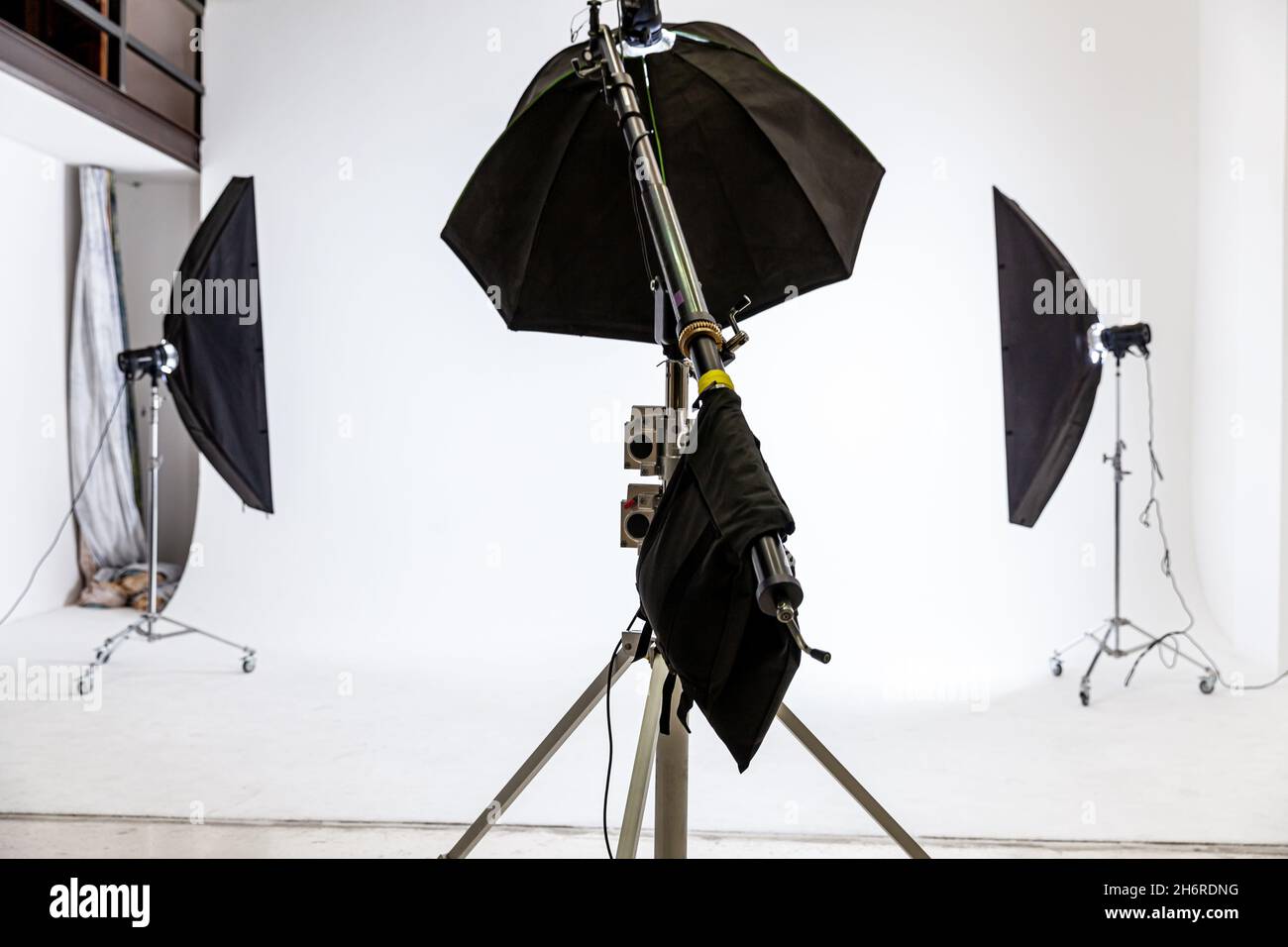 Empty photo studio with lighting equipment. Photographer workplace ...