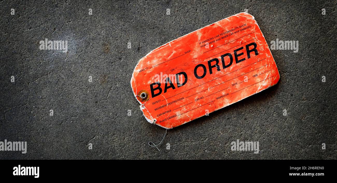 Red tag marker ticket or label with string for bad order on ground ...