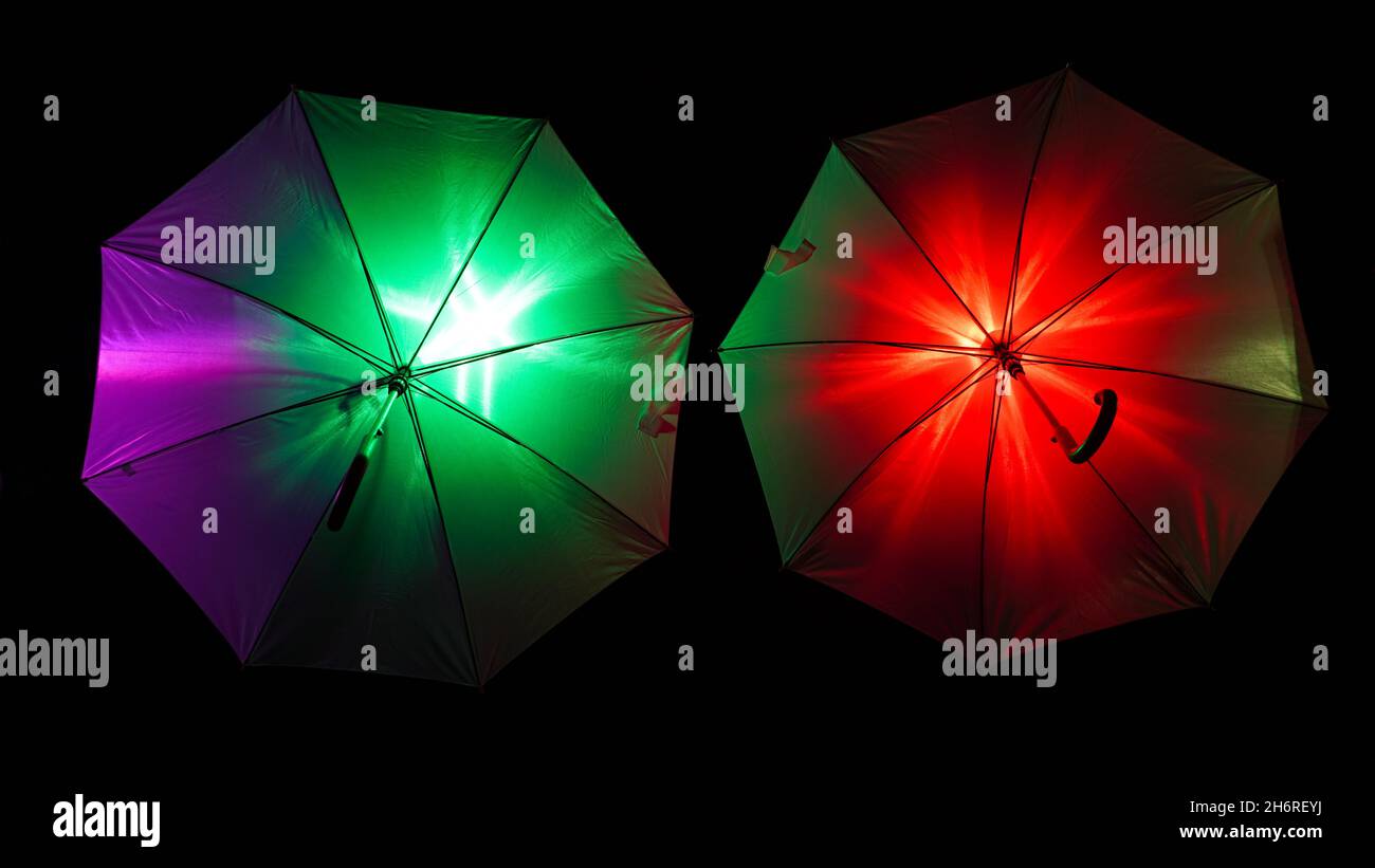 colorful illuminated umbrellas with light Stock Photo - Alamy